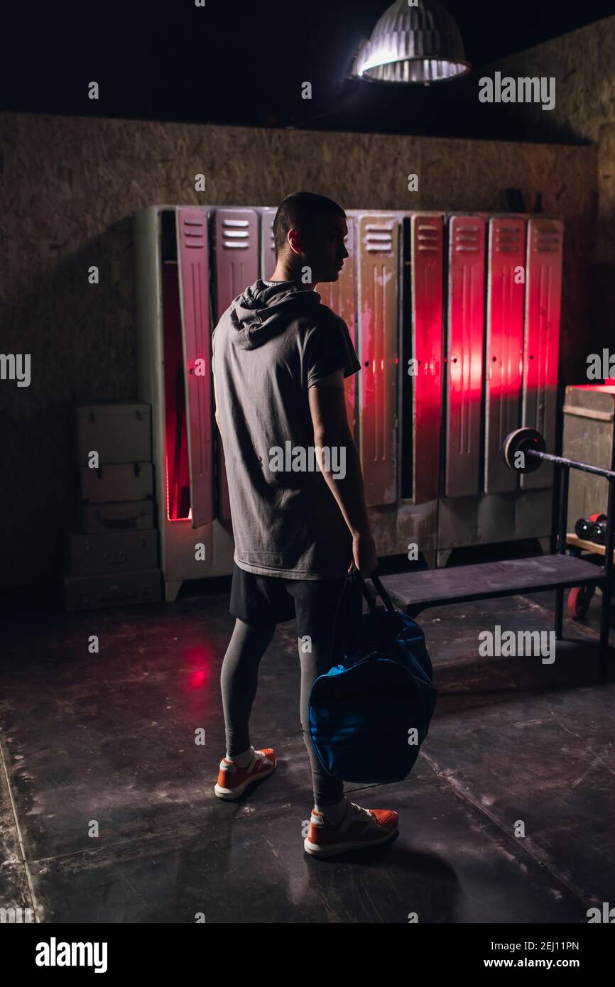 Man get ready for boxing training in the locker room Stock Photo - Alamy