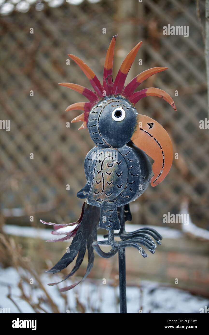 Portrait of a garden decoration, an iron model parrot Stock Photo - Alamy