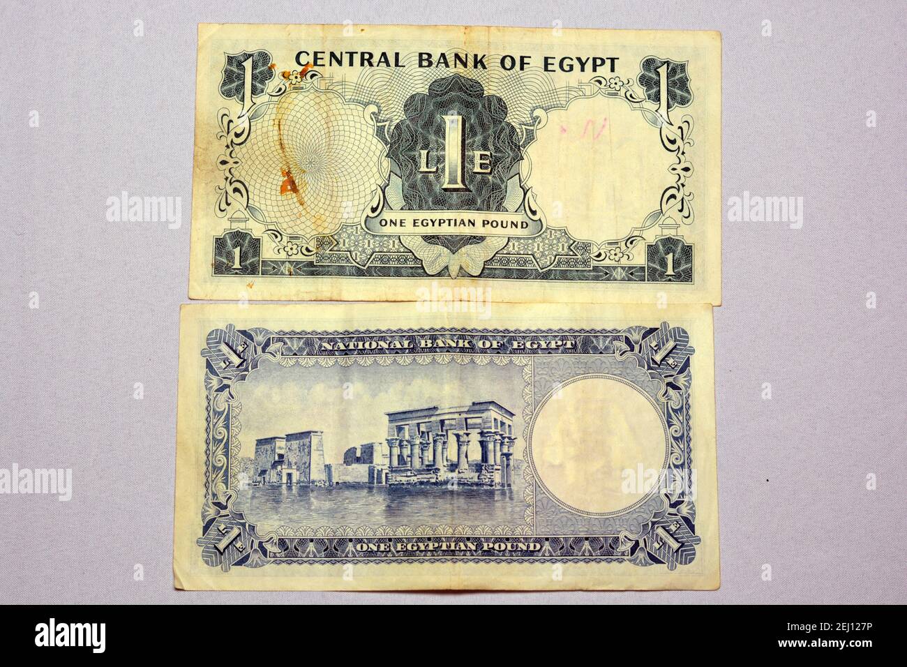 a collection of a blurred Egyptian one pound 1956 banknote and 1967 ...