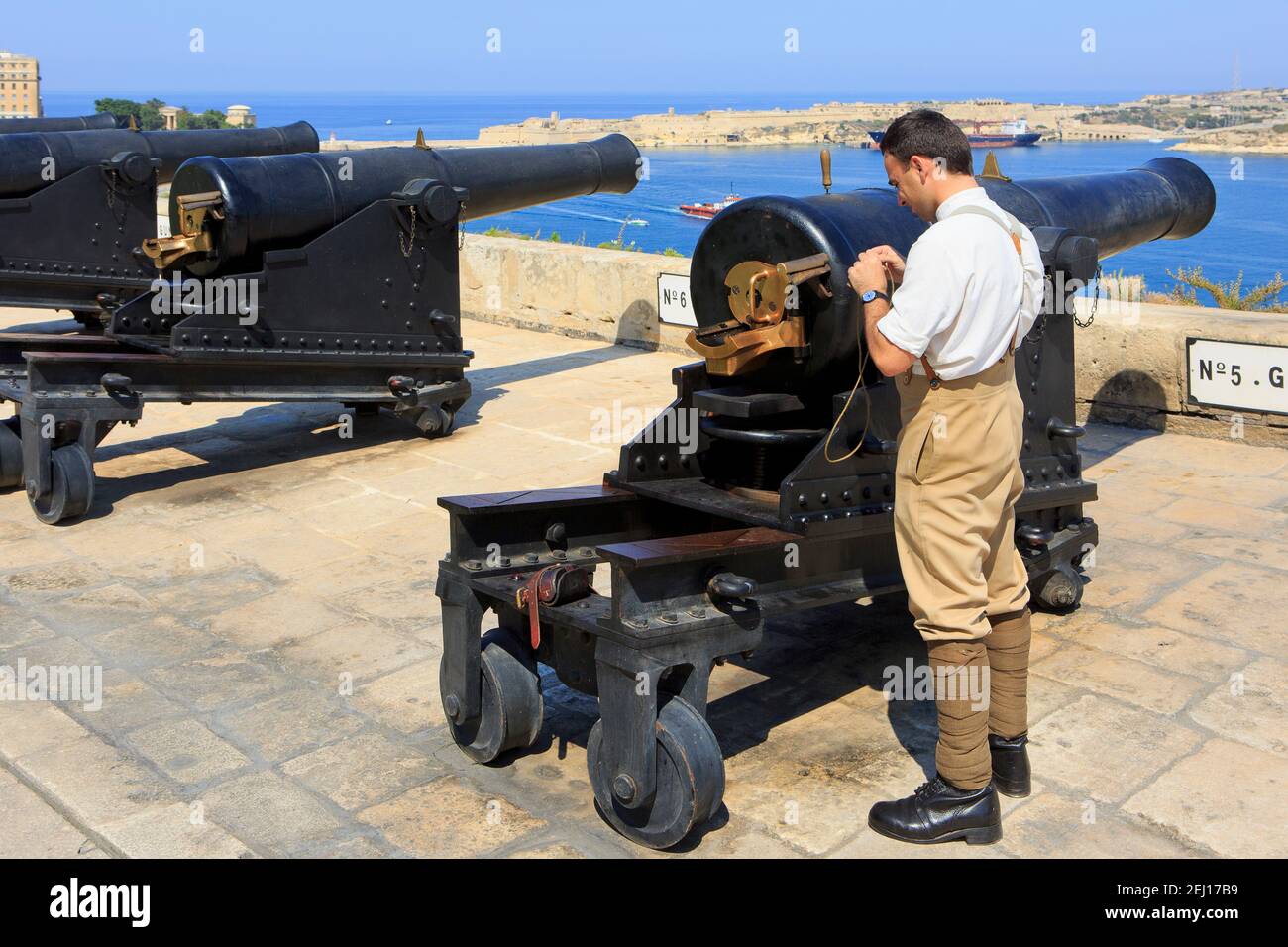 A gunner preparing to fire a SBBL 32-pounder gun at the Saluting ...