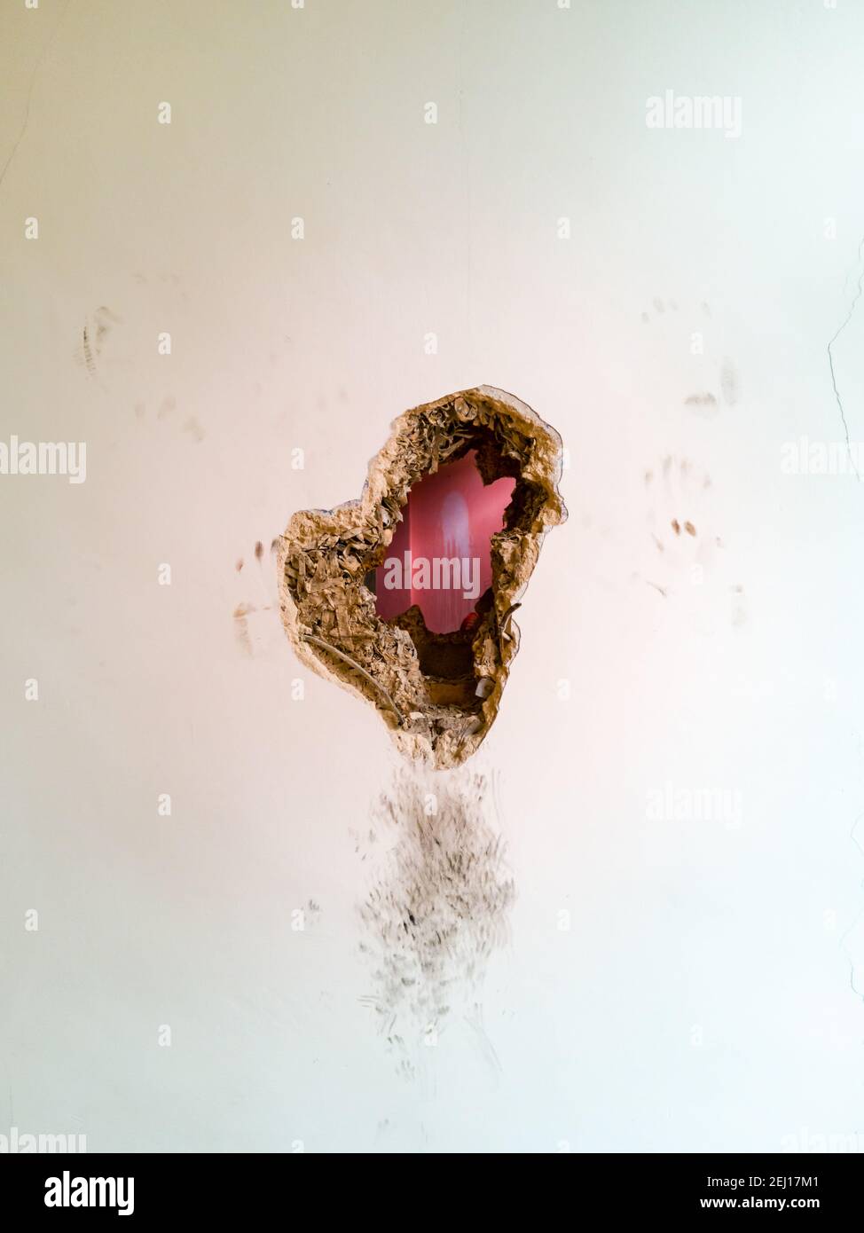 Small hole in thick wooden wall of old tenement house Stock Photo - Alamy