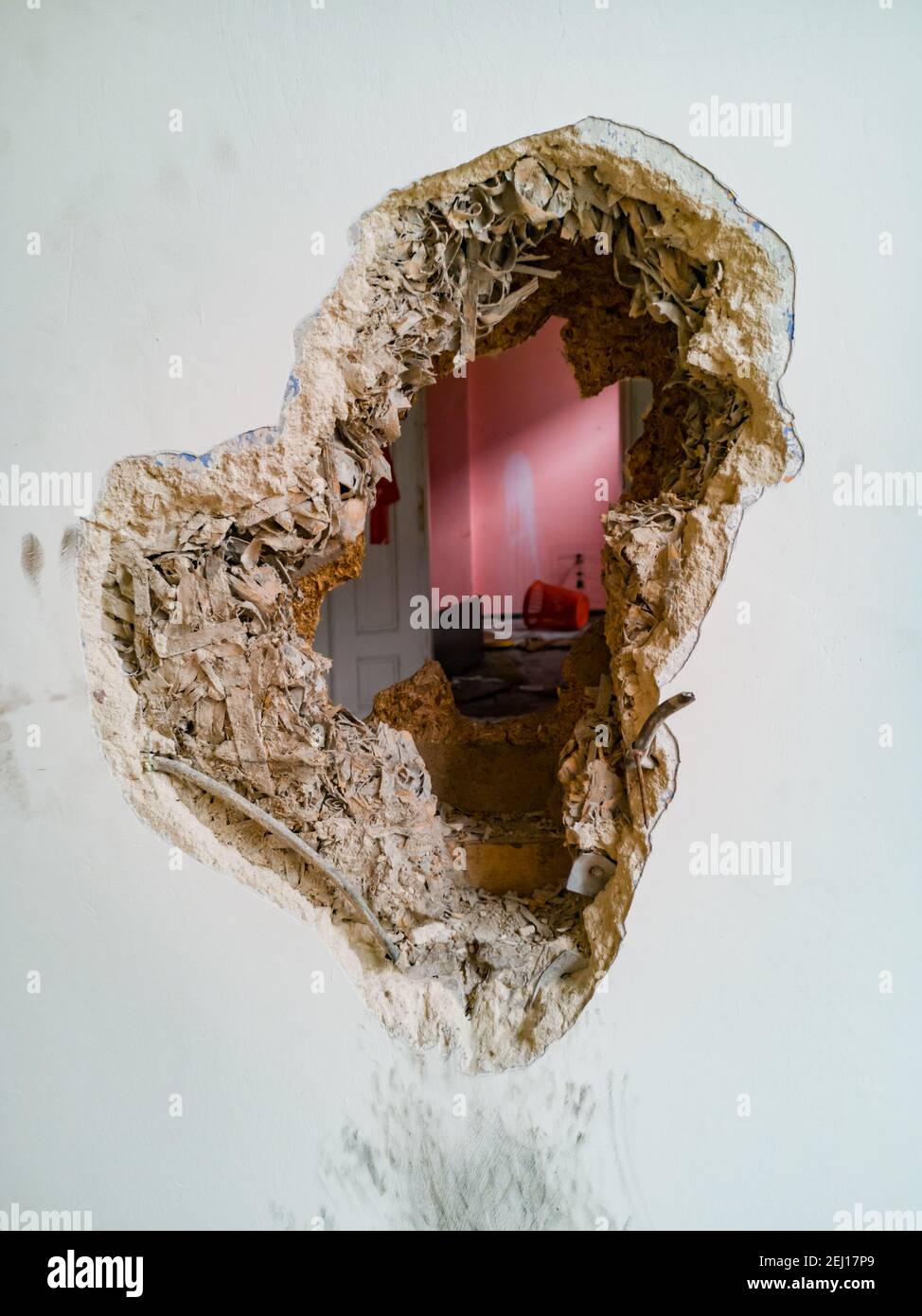 Small hole in thick wooden wall of old tenement house Stock Photo - Alamy