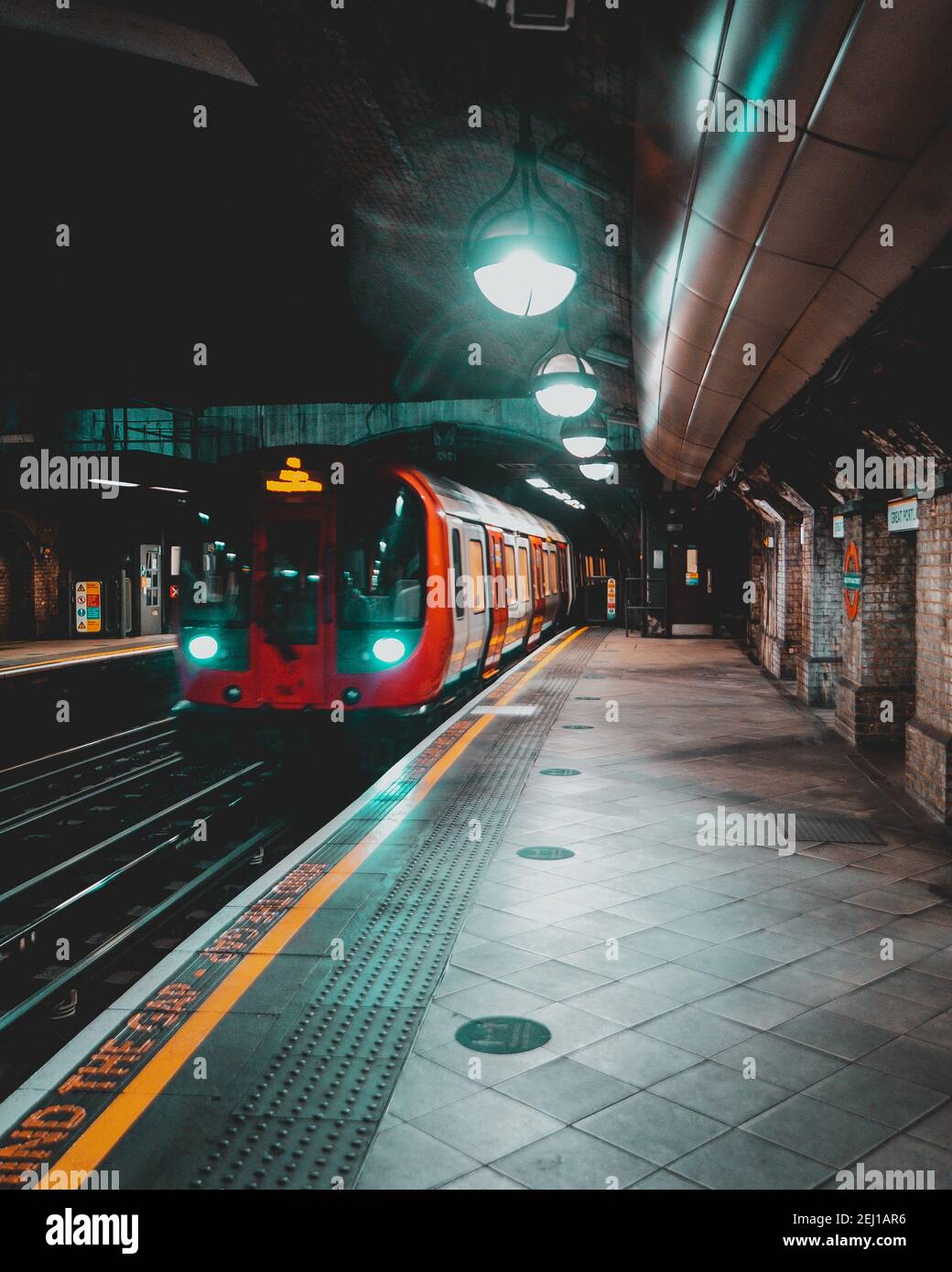 London UK January 2021 Red underground metro Tube train approaching the ...