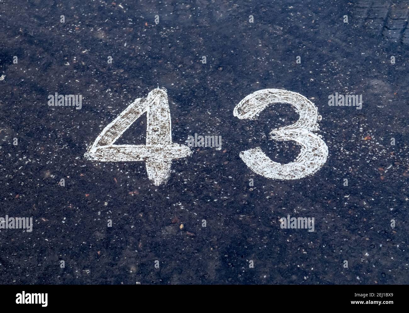 Numbers painted on concrete and asphalt textured surfaces Stock Photo ...
