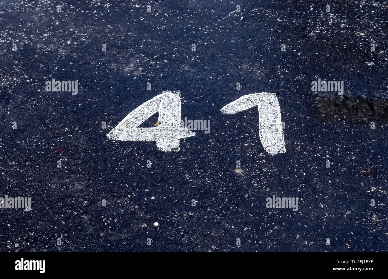Numbers painted on concrete and asphalt textured surfaces Stock Photo ...