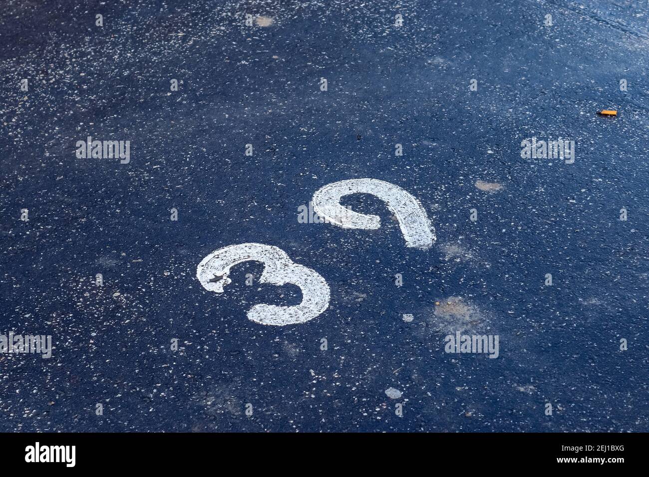 Numbers painted on concrete and asphalt textured surfaces Stock Photo ...