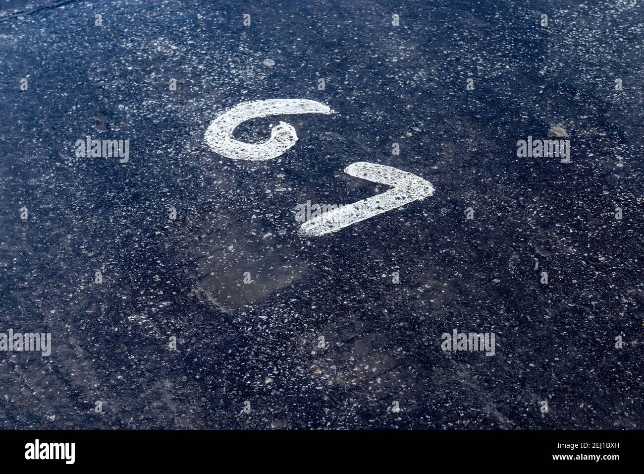 Numbers painted on concrete and asphalt textured surfaces Stock Photo ...