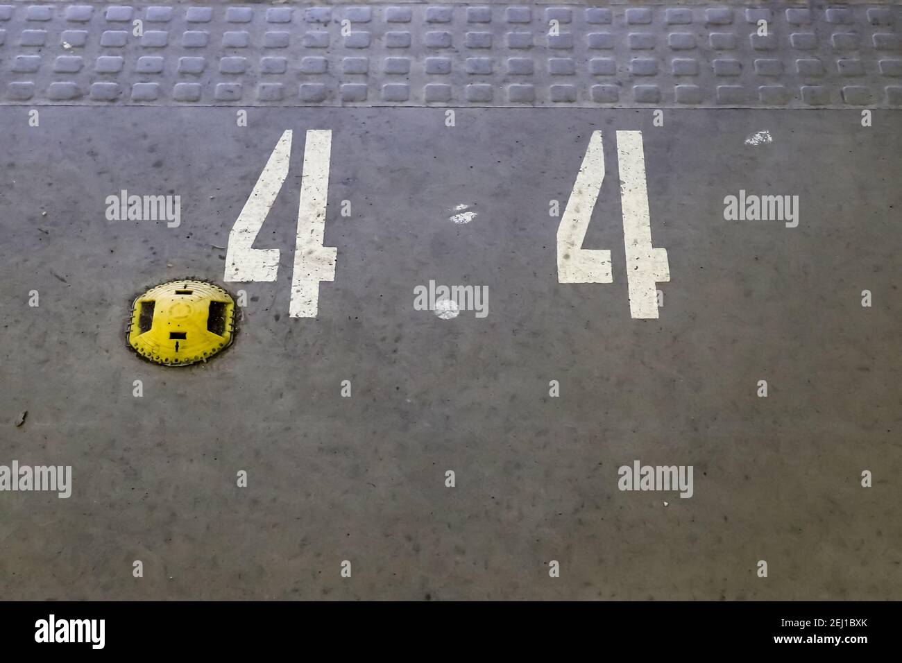Numbers painted on concrete and asphalt textured surfaces Stock Photo ...