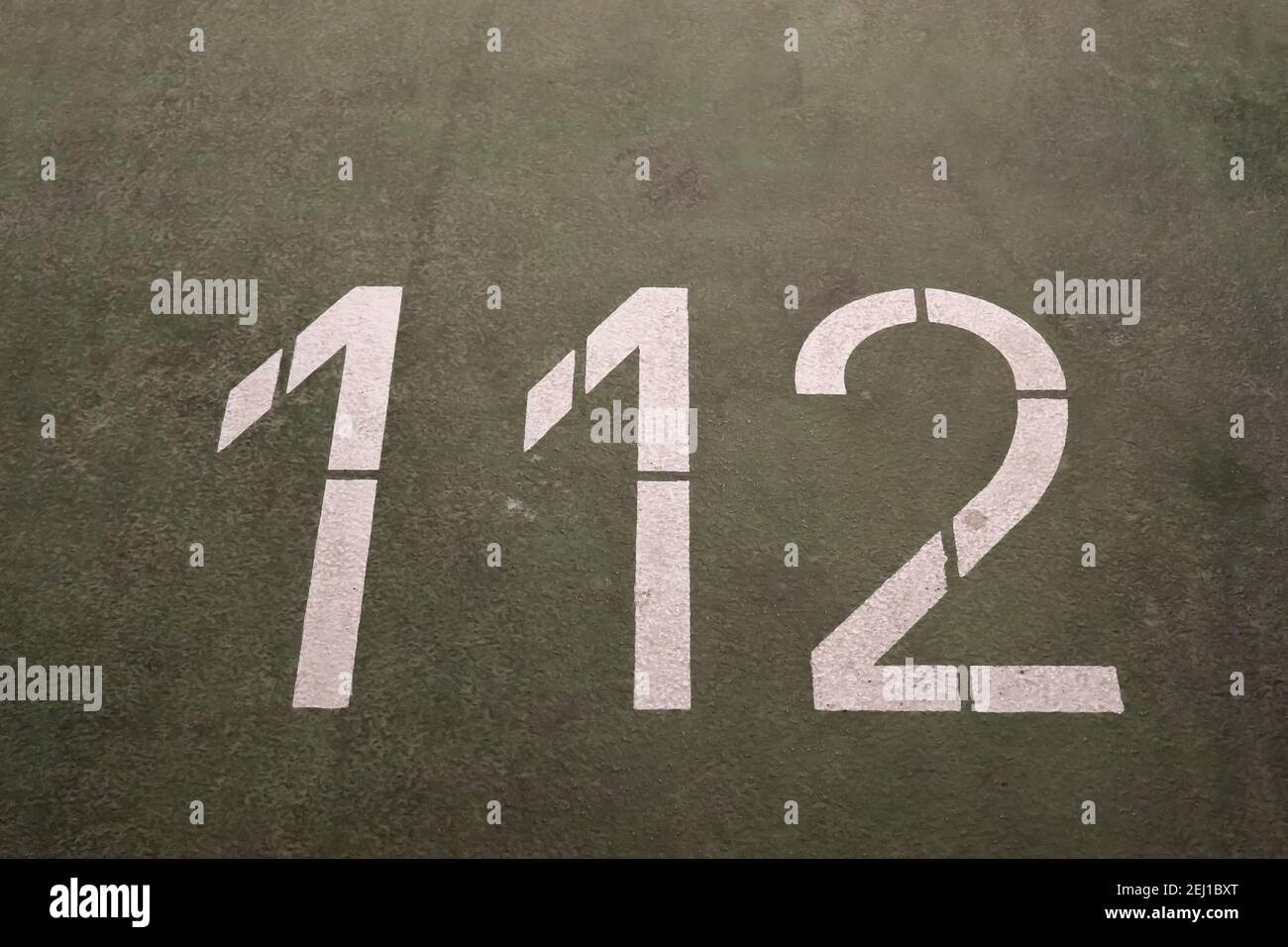 Numbers painted on concrete and asphalt textured surfaces Stock Photo ...
