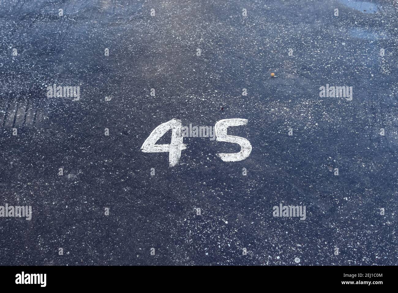 Numbers painted on concrete and asphalt textured surfaces Stock Photo ...