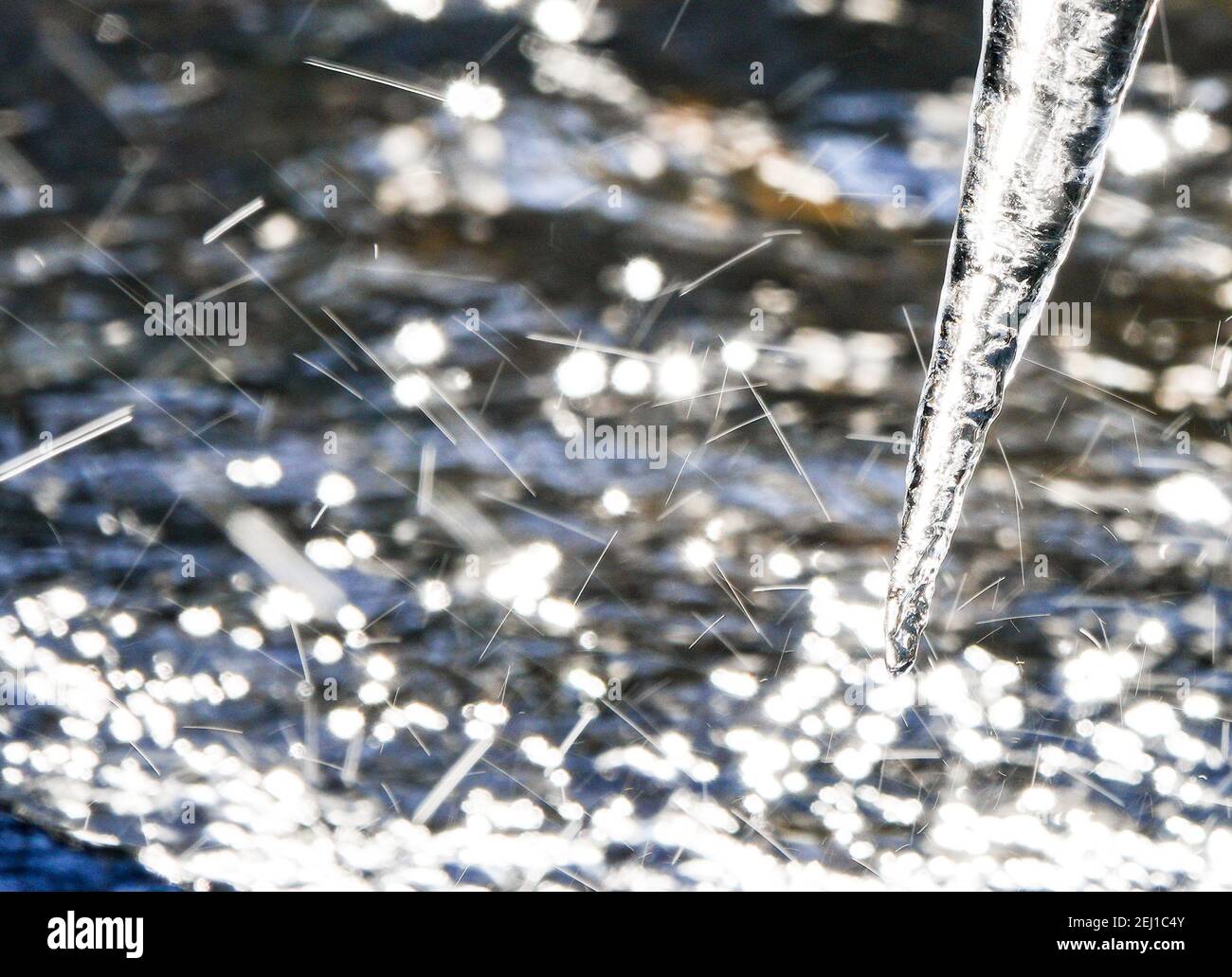 Frozen icicle spikes above a stream with water sprites due to a slow ...