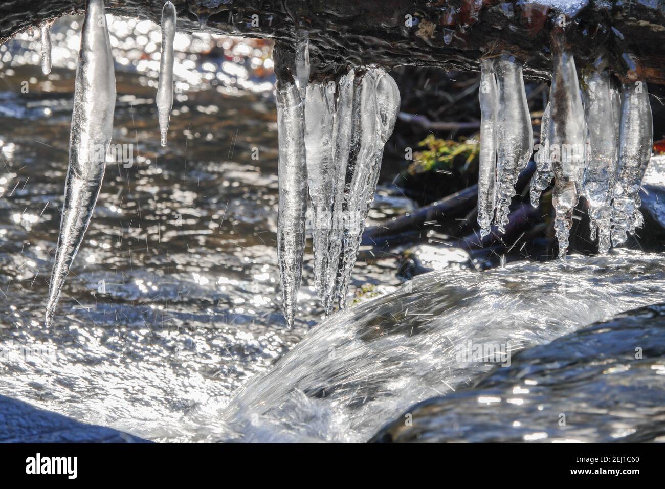 Frozen icicle spikes above a stream with water sprites due to a slow ...