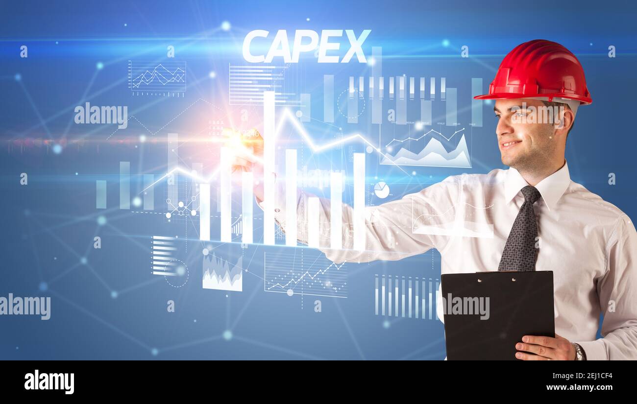 Handsome businessman with helmet drawing CAPEX inscription ...