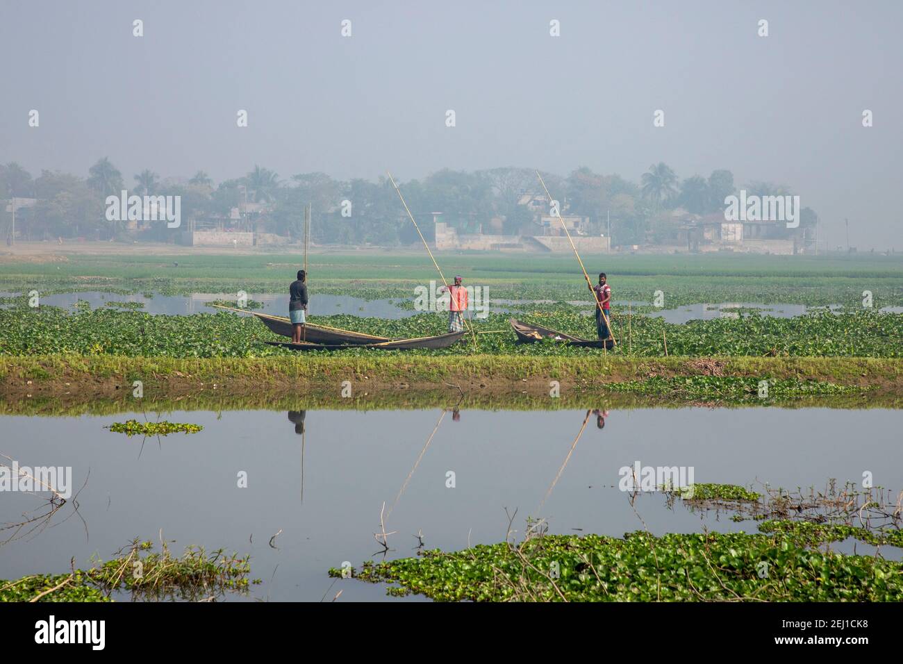 Boatmen have a tough time taking their craft loaded with passengers ...