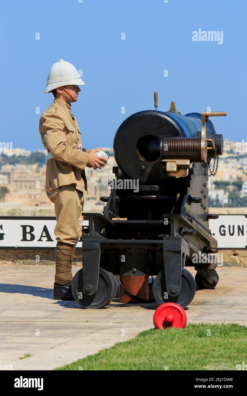 A gunner preparing to fire a SBBL 32-pounder gun at the Saluting ...