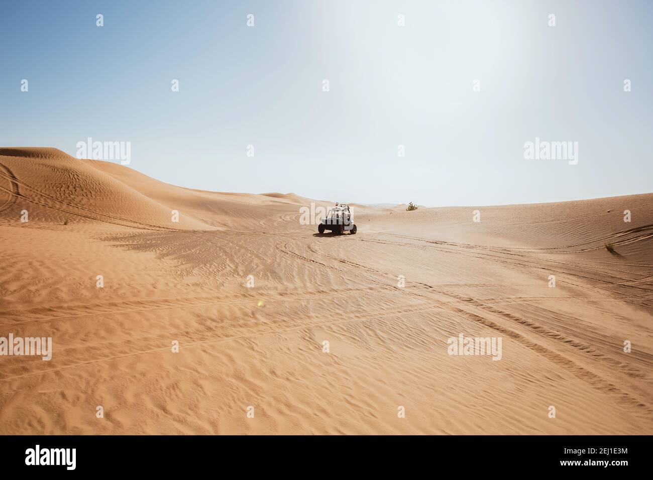 Black quad buggy bike ride at desert sunny landscape at Al awir desert ...