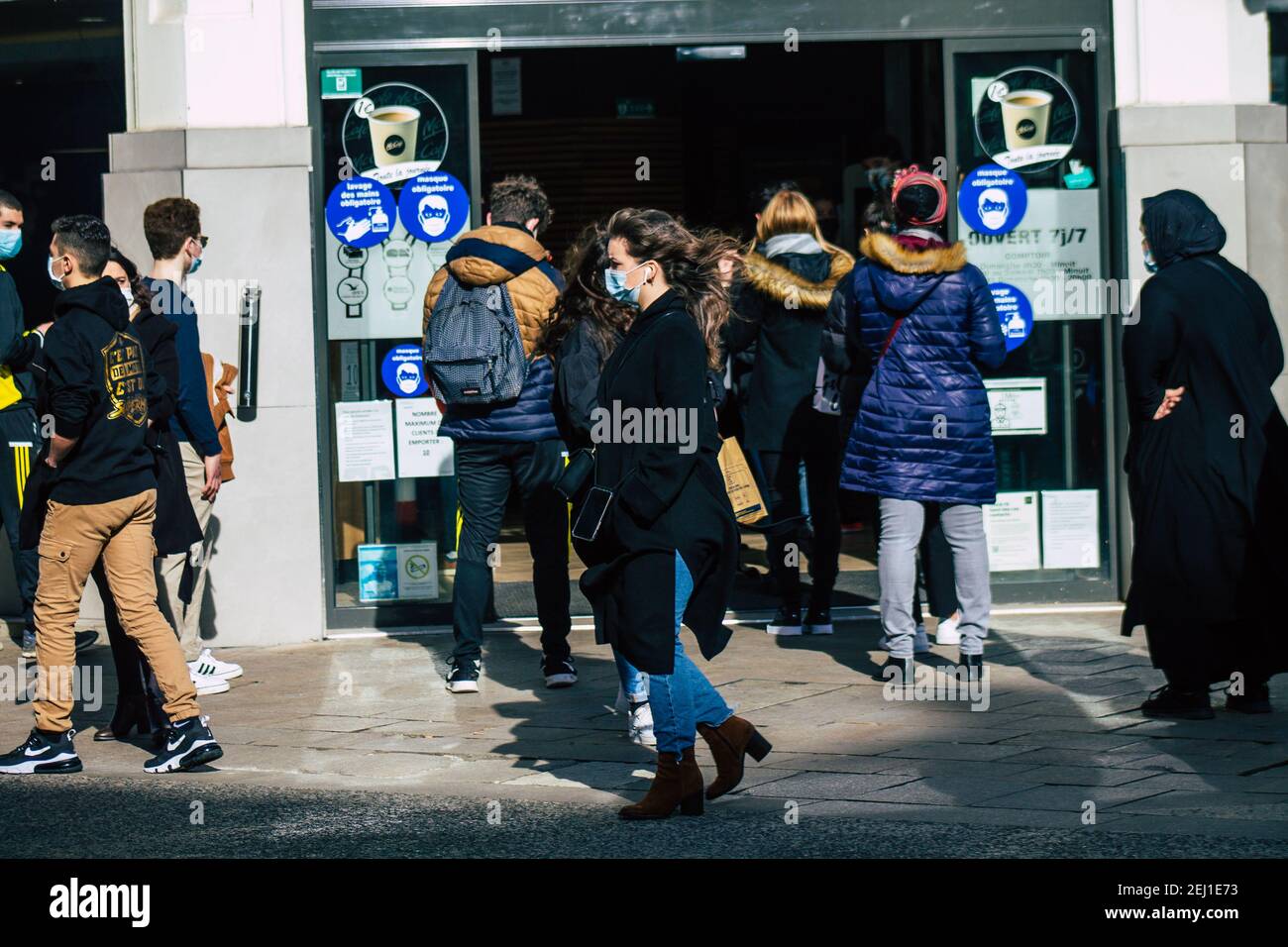 Reims France February 20, 2021 Unidentified people with a face mask queueing at the market in ...