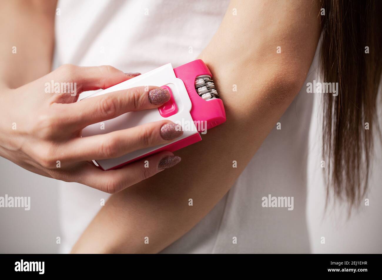 Removal of unwanted hair on the hands Stock Photo - Alamy