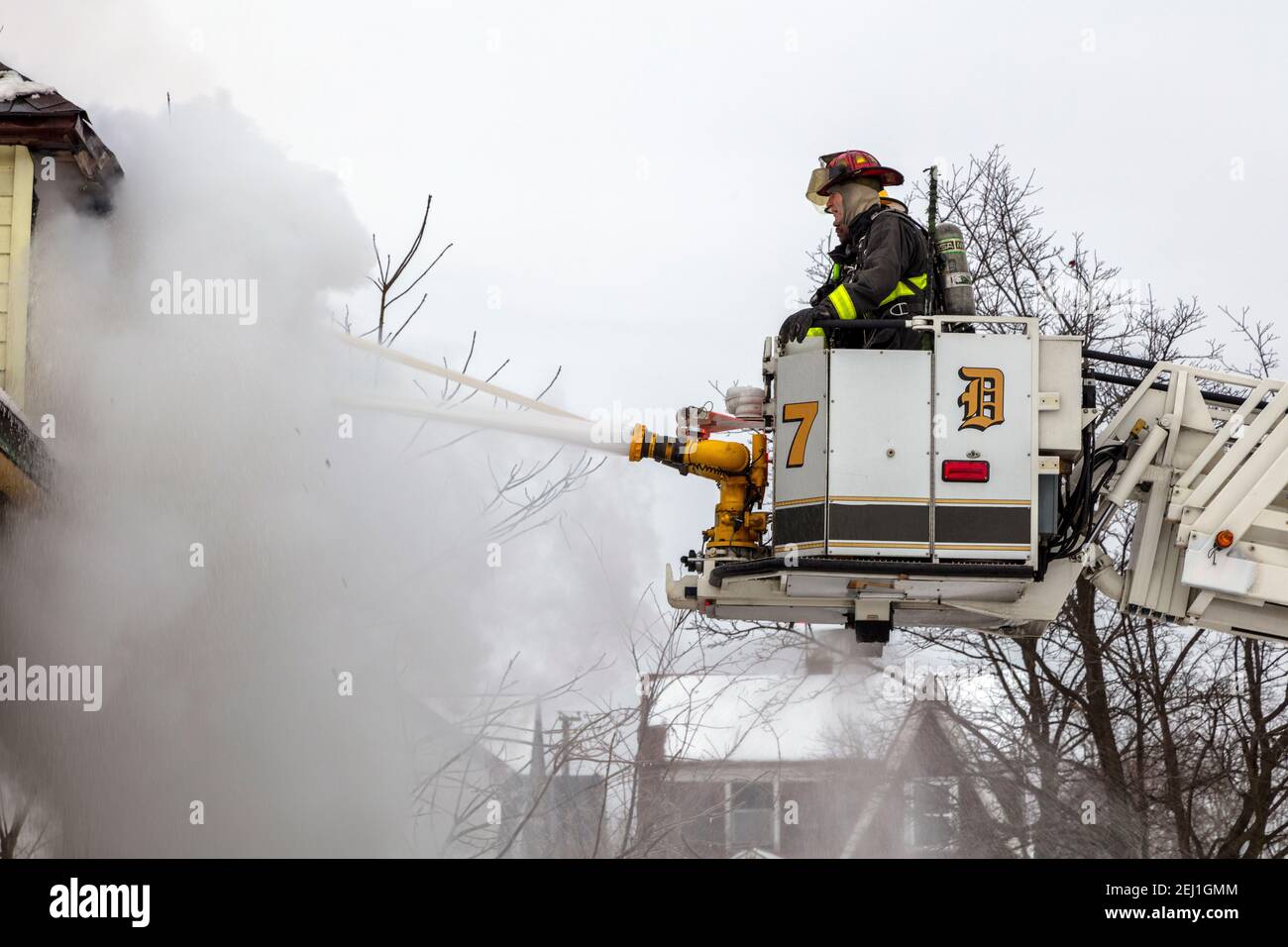 Firefighters in Tower Ladder fighting fire, Detroit, Michigan, USA, by ...