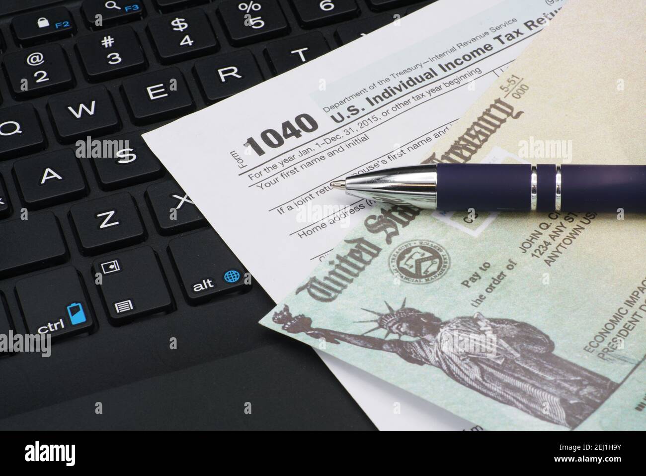 US IRS Internal Revenue Service income tax filing form 1040 with pen on ...