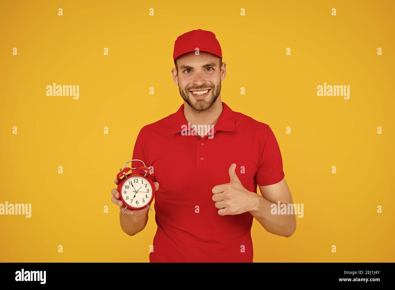 Promptness and punctuality. Delivery time. Delivery courier with clock ...