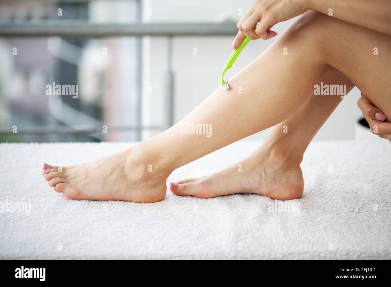 Skin care and health, fit woman shaving her legs with razor Stock Photo ...