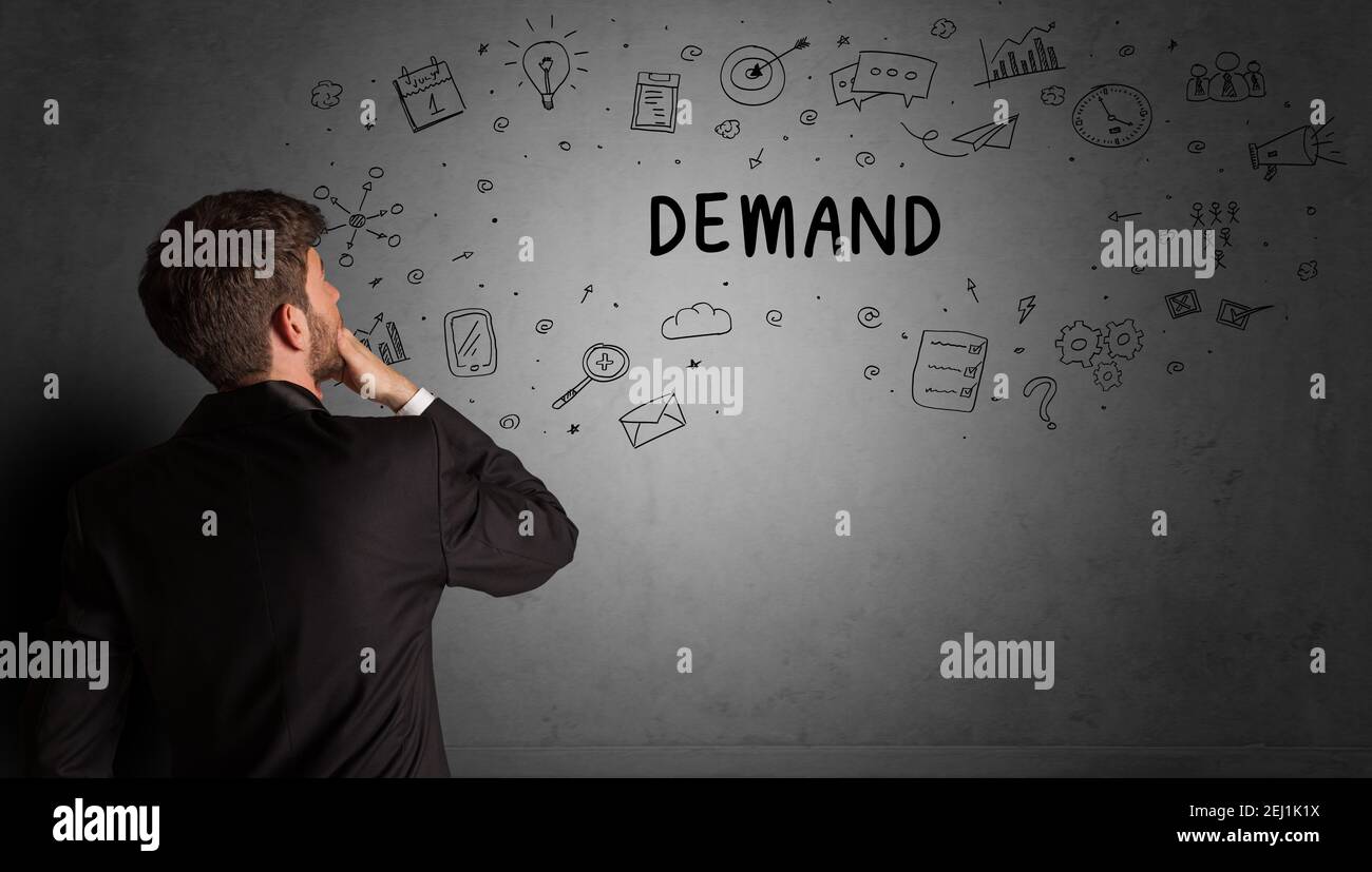 businessman drawing a creative idea sketch with DEMAND inscription ...