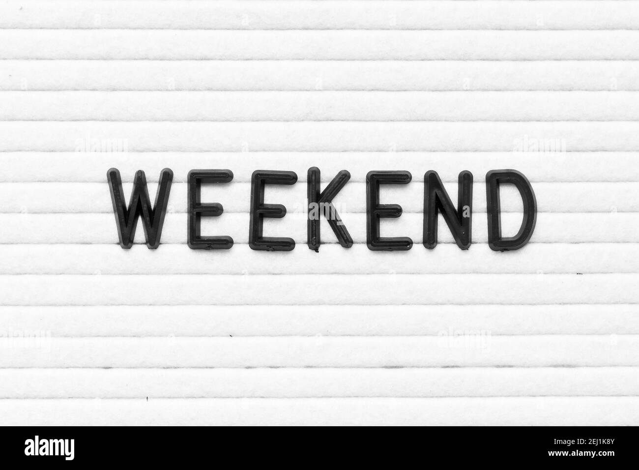 Black color letter in word weekend on white felt board background Stock ...