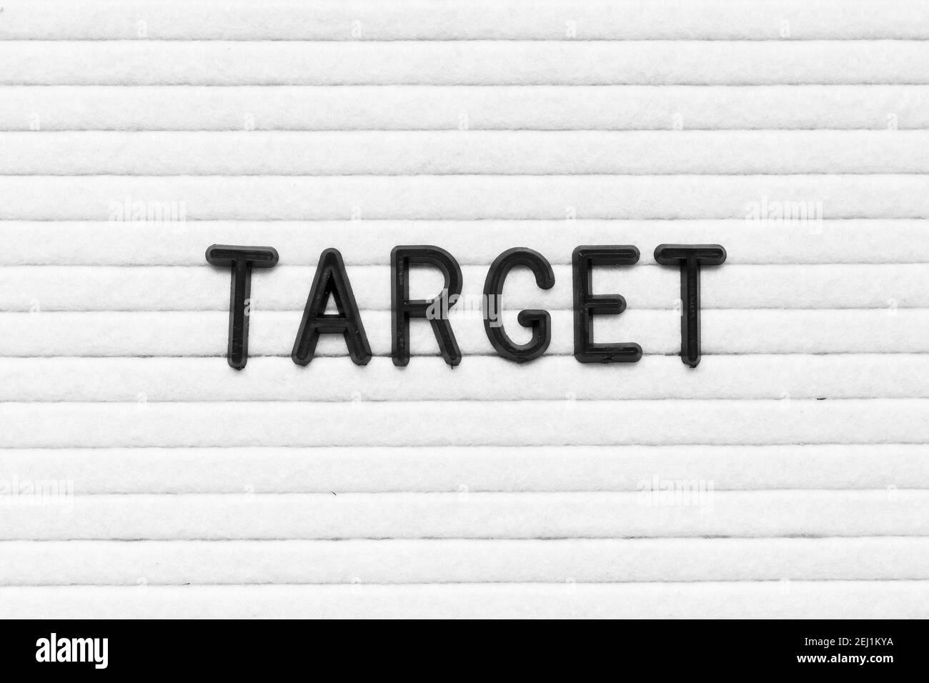 Black color letter in word target on white felt board background Stock ...