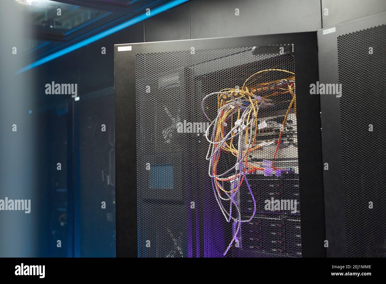 Background image of server cabinet with cables and wires in data center ...