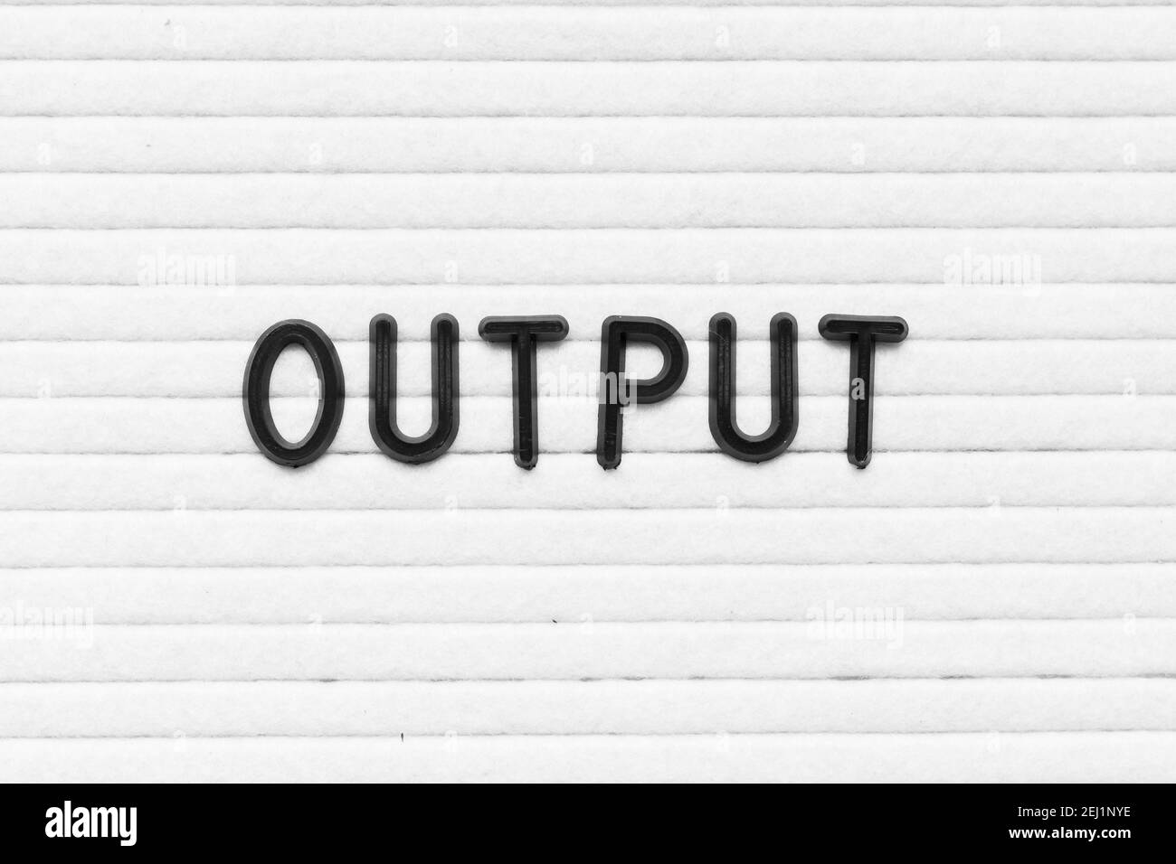 Black color letter in word output on white felt board background Stock ...