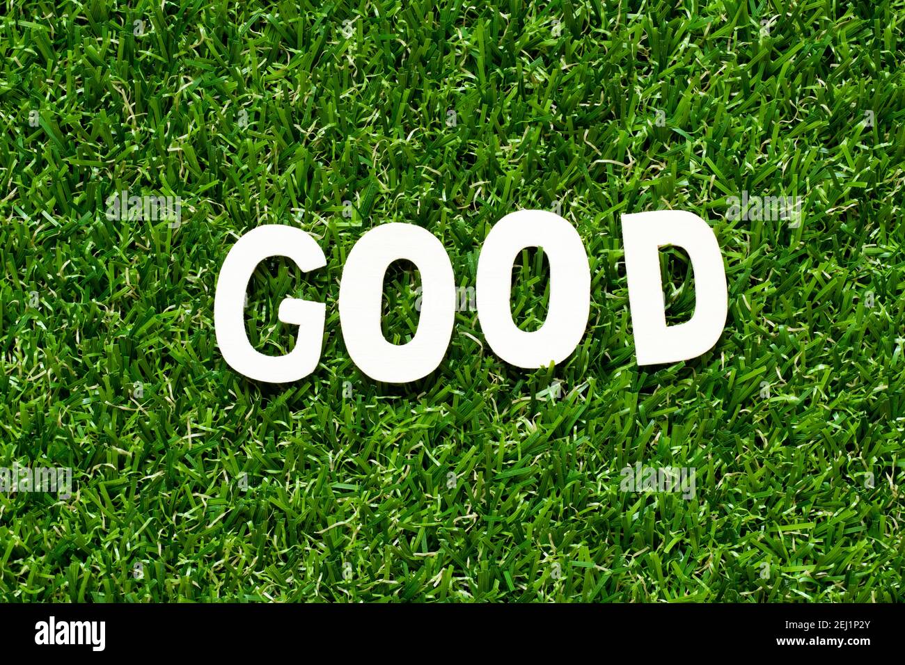 Wood alphabet letter in word good on green grass background Stock Photo ...