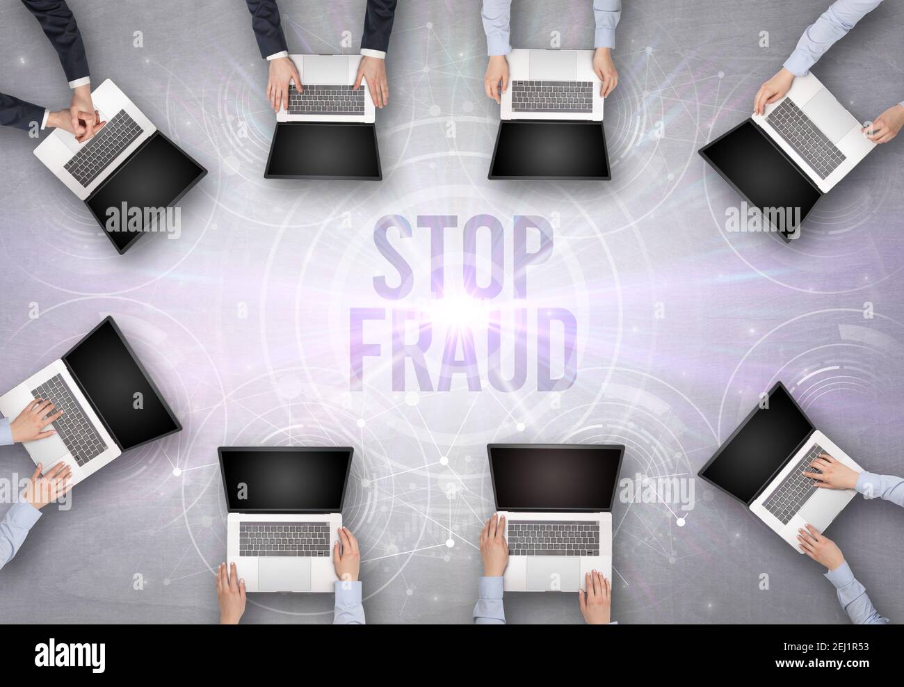 Group of people in front of a laptop with STOP FRAUD insciption, web ...