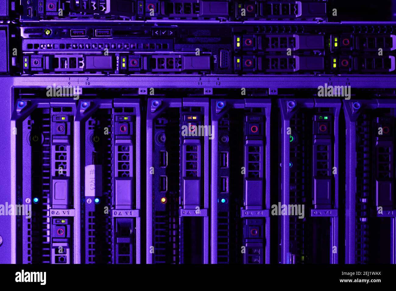 Background image of rack servers in supercomputer network lit by blue ...