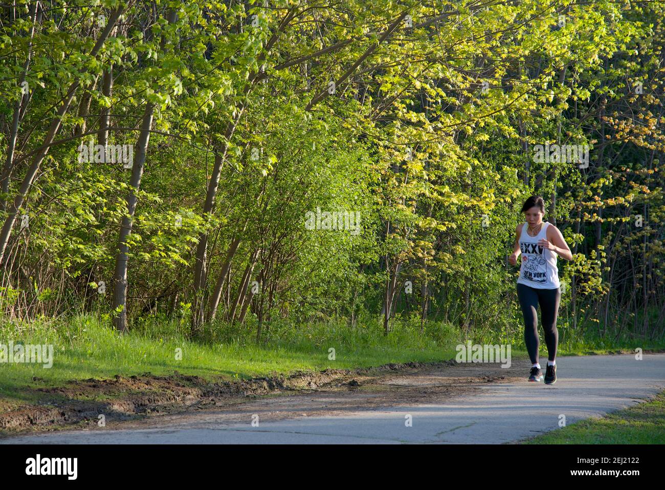 Toronto, Ontario / Canada - 05-22-2014: Woman jogging in the public ...