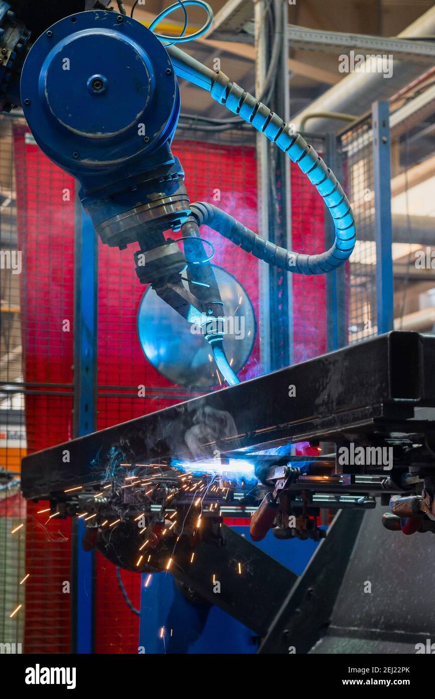 Welding robot in the process. Modern welding production Stock Photo - Alamy