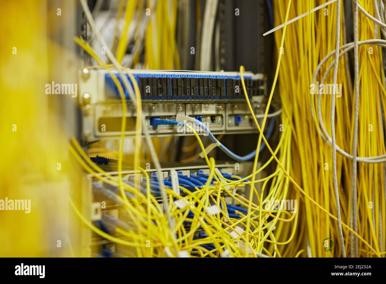 Close up background image of server room with internet cables and wires ...