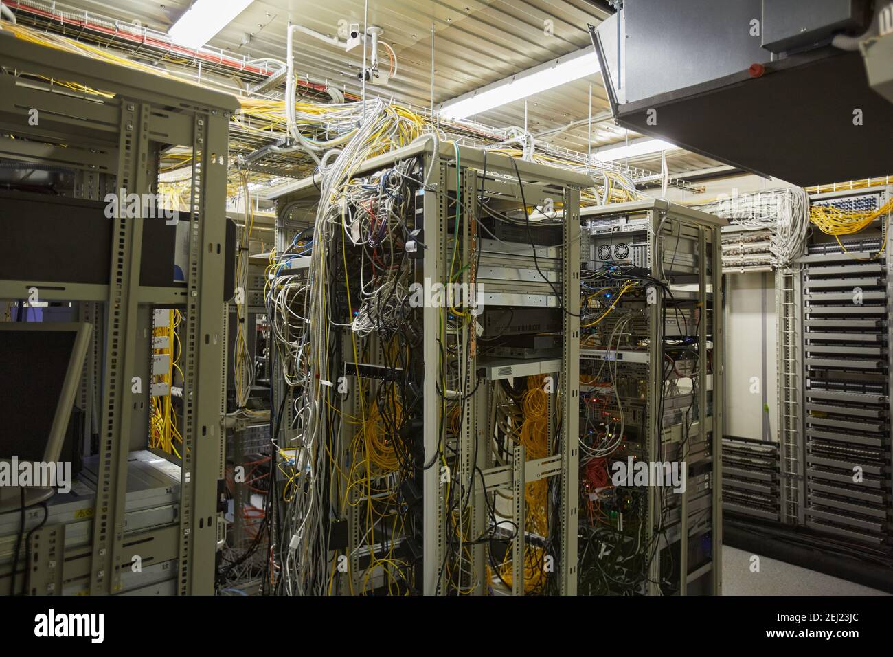 Wide angle background image of server room network with internet cables ...