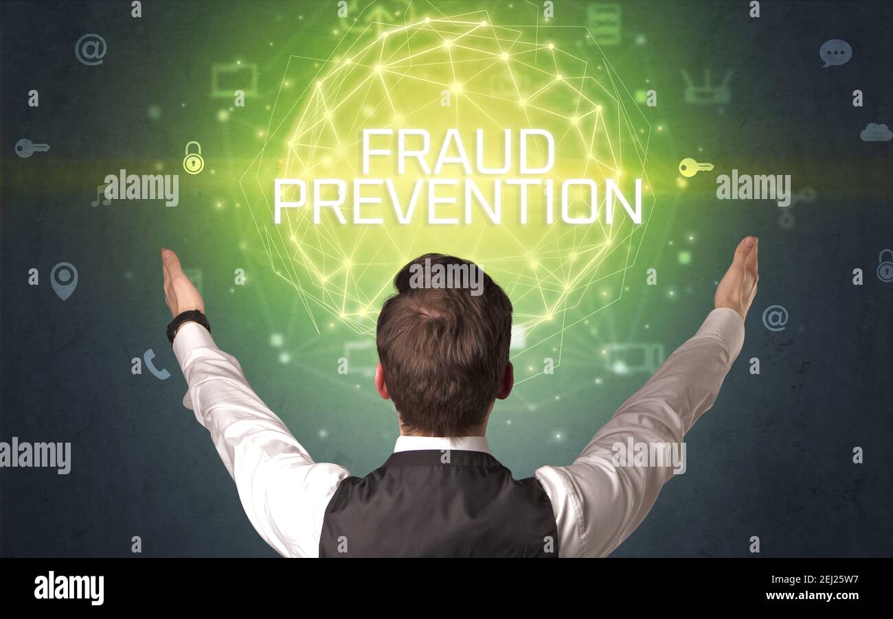 Rear view of a businessman with FRAUD PREVENTION inscription, online ...
