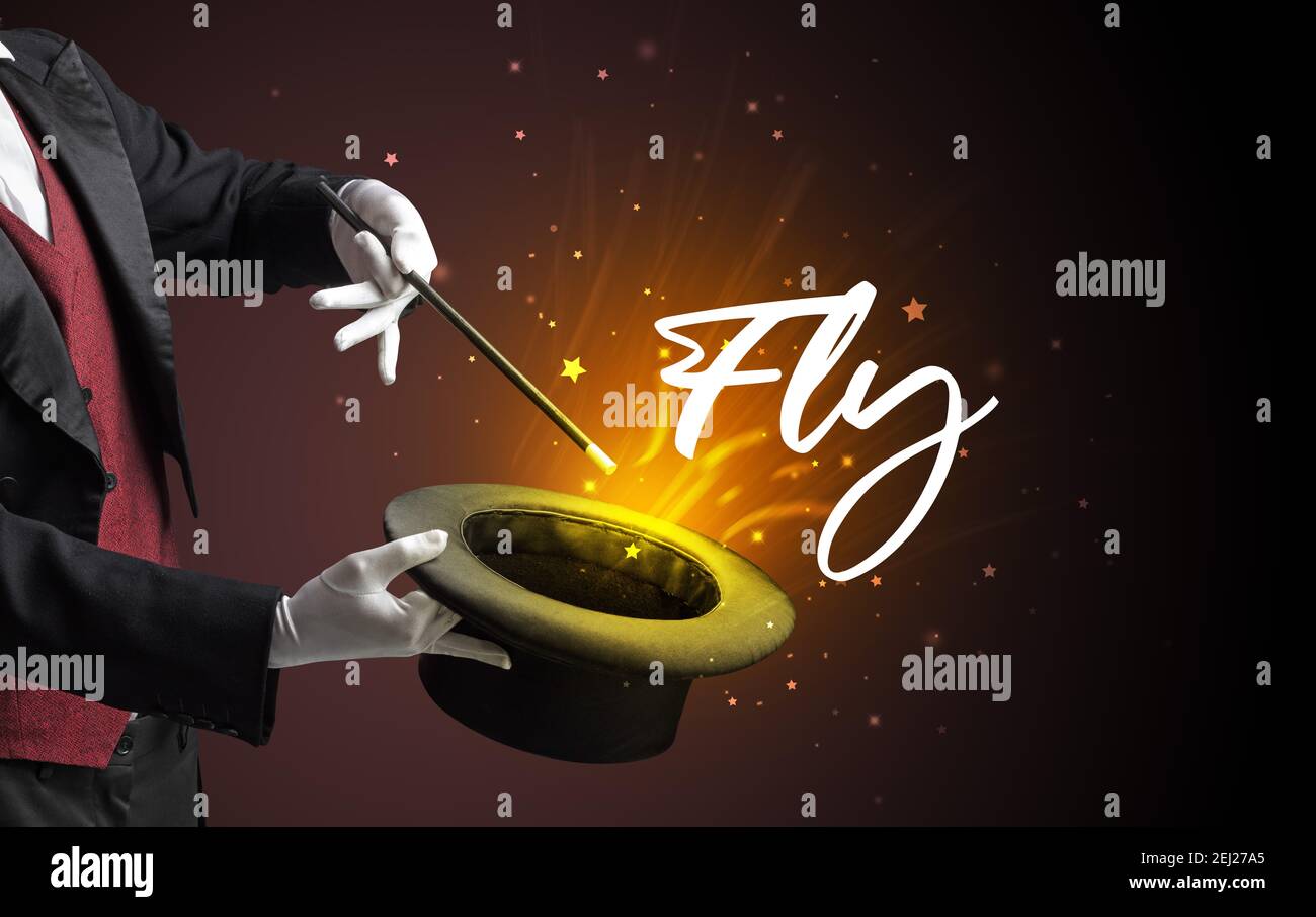 Magician is showing magic trick with Fly inscription, traveling concept ...