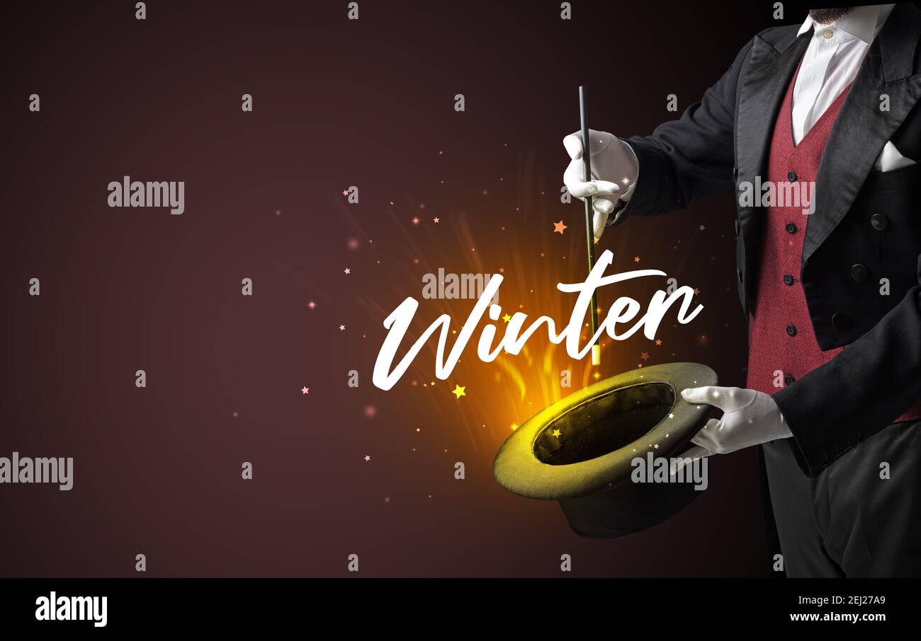 Magician is showing magic trick with Winter inscription, traveling ...