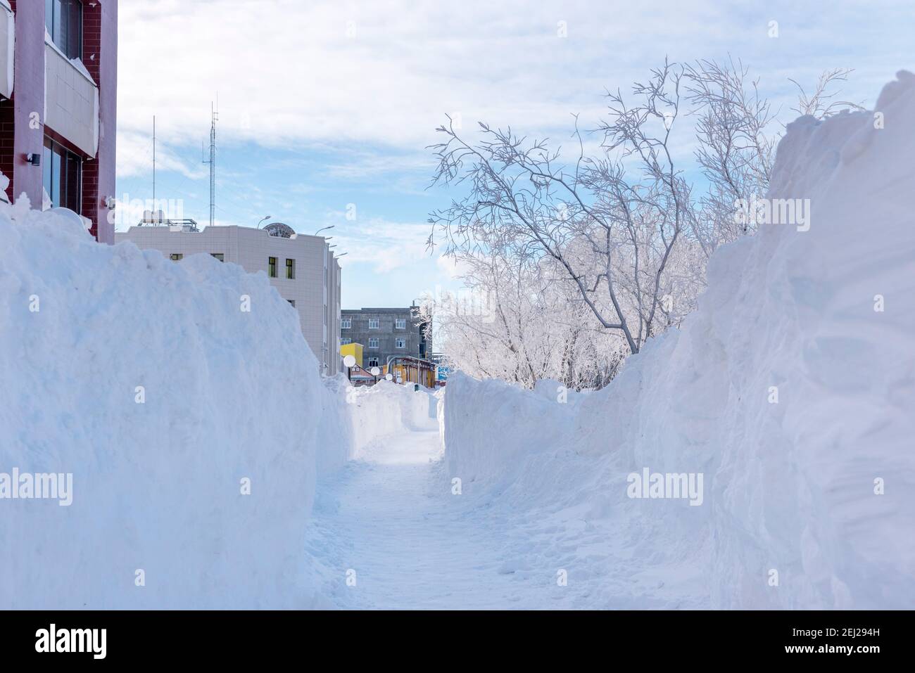 Pavement in the snow trench after snowstorm Stock Photo - Alamy