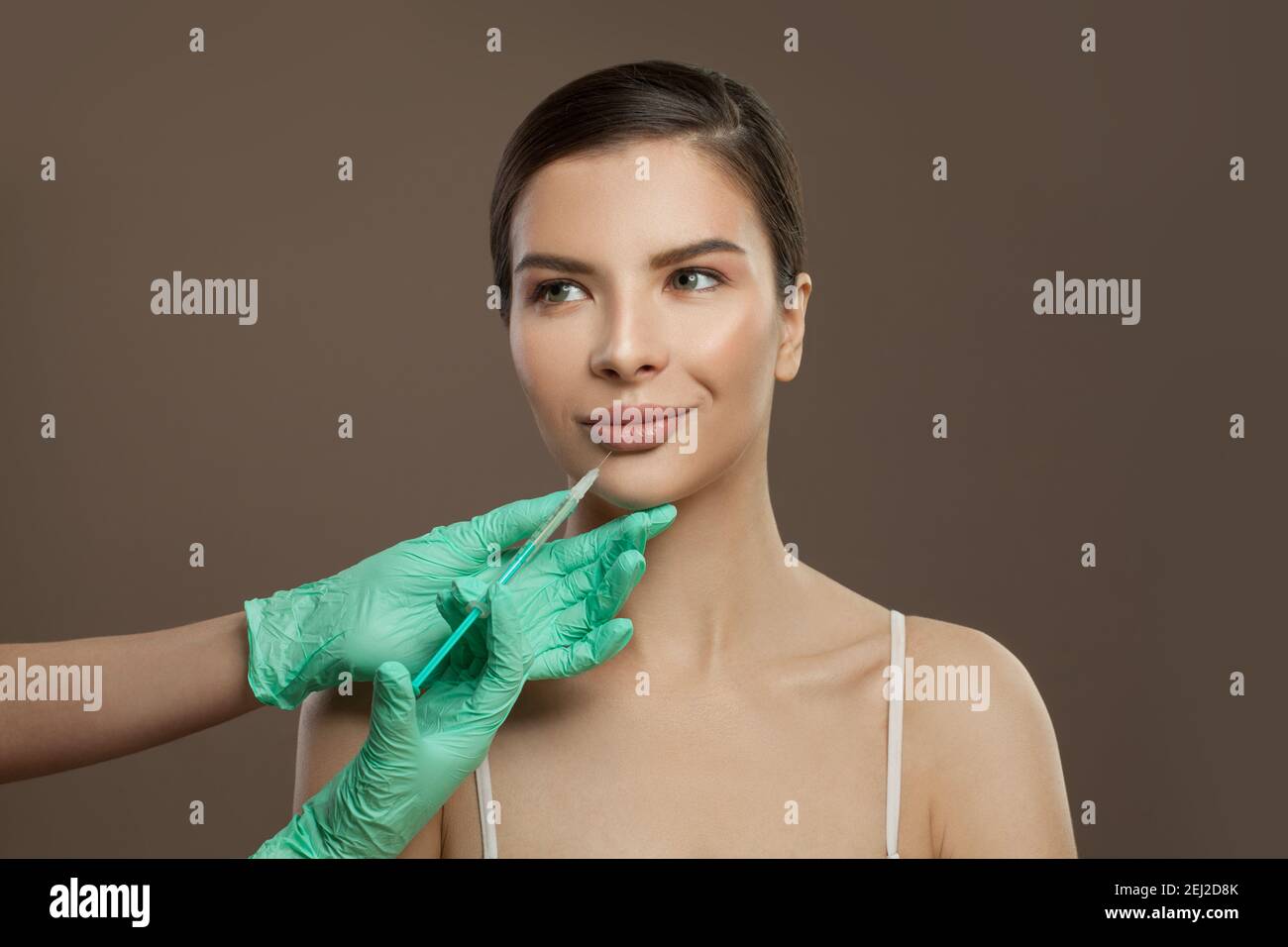 Doctor holding syringe near hi-res stock photography and images - Alamy