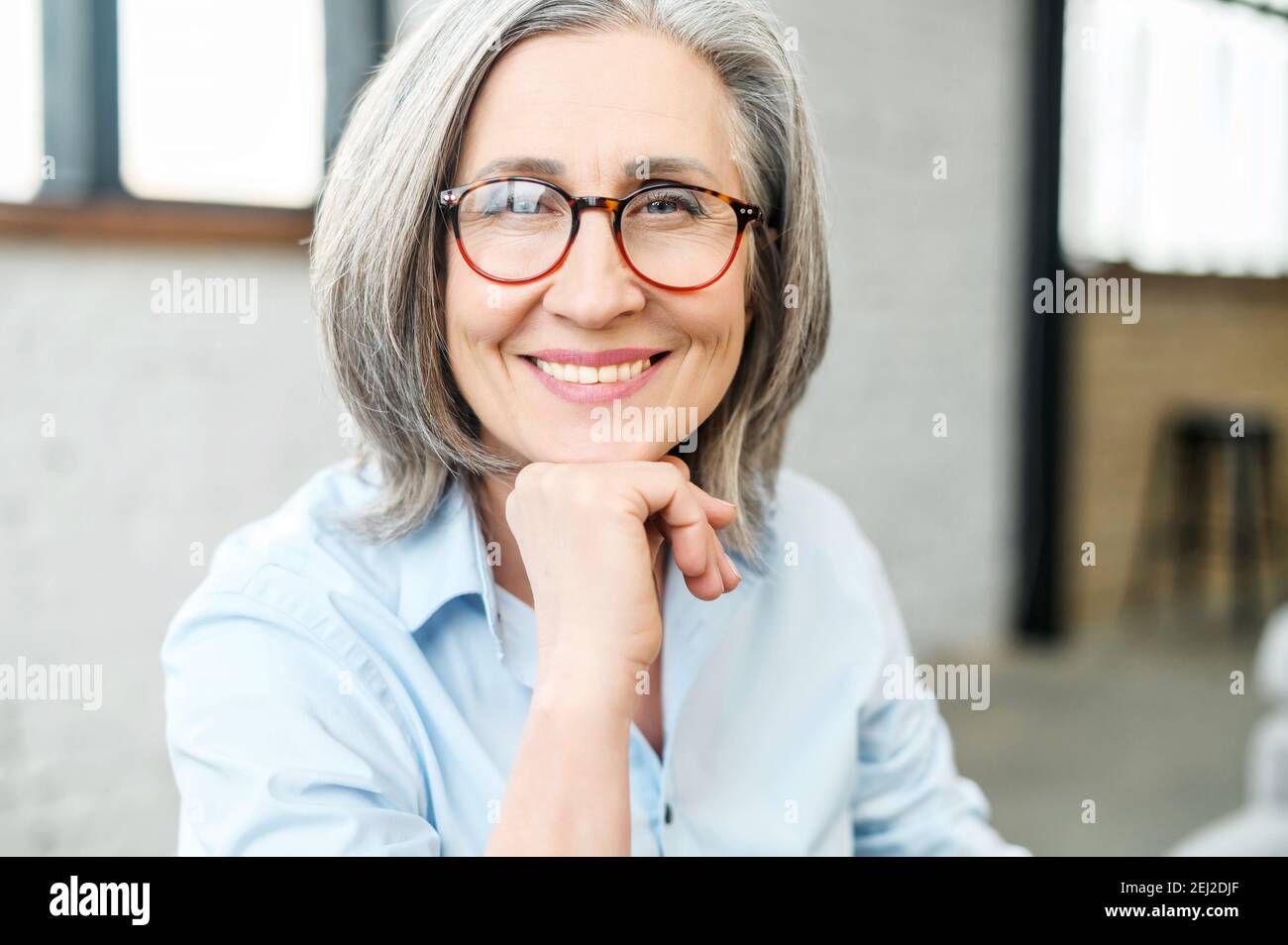 Headshot portrait of a charming beaming elegant mature woman with her ...