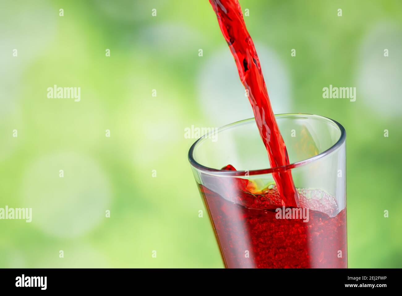 juice pouring into glass Stock Photo - Alamy