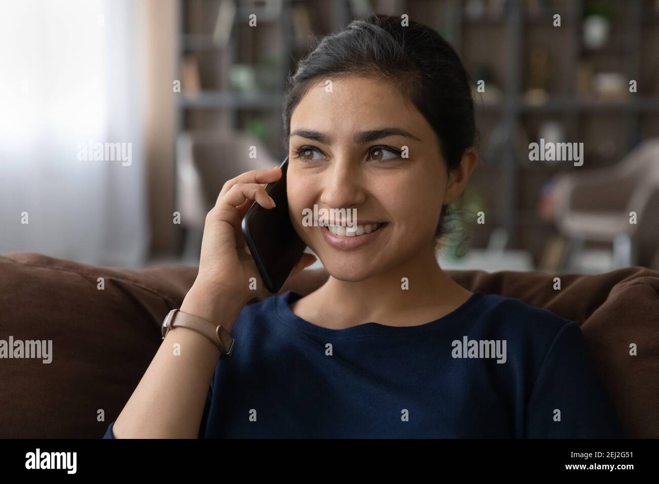 Smiling Indian woman have pleasant cellphone call Stock Photo - Alamy