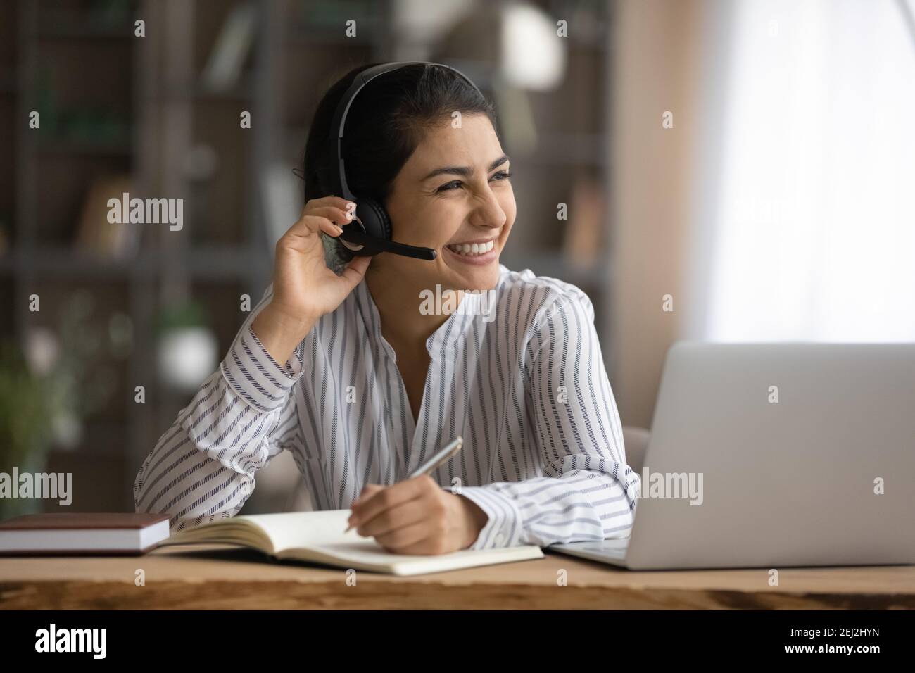 Smiling Indian woman study online on computer Stock Photo - Alamy