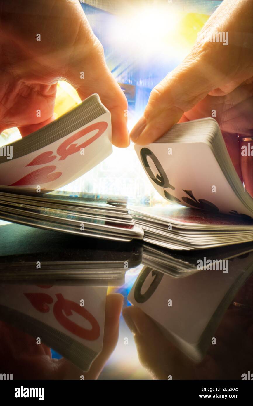 Woman shuffling cards hi-res stock photography and images - Alamy