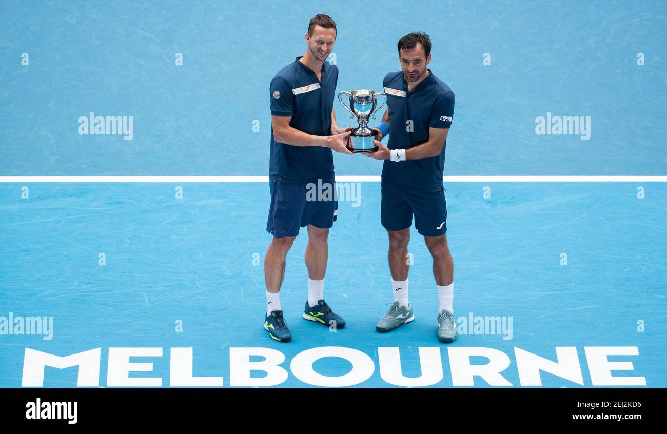 Melbourne, Australia. 21st Feb, 2021. Champions Filip Polasek (L) of ...