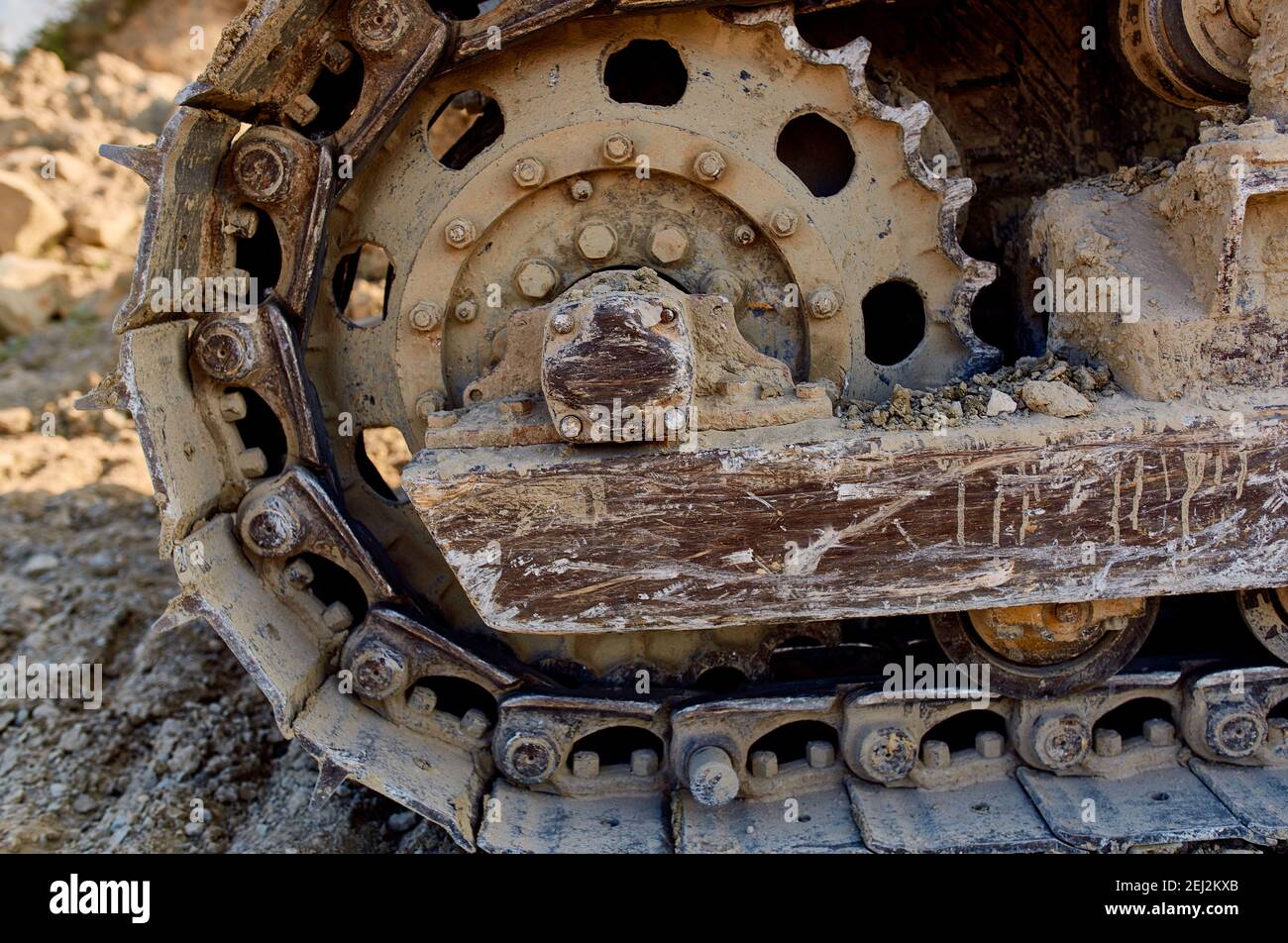 yellow excavator with a steering wheel digging out the ground summer ...